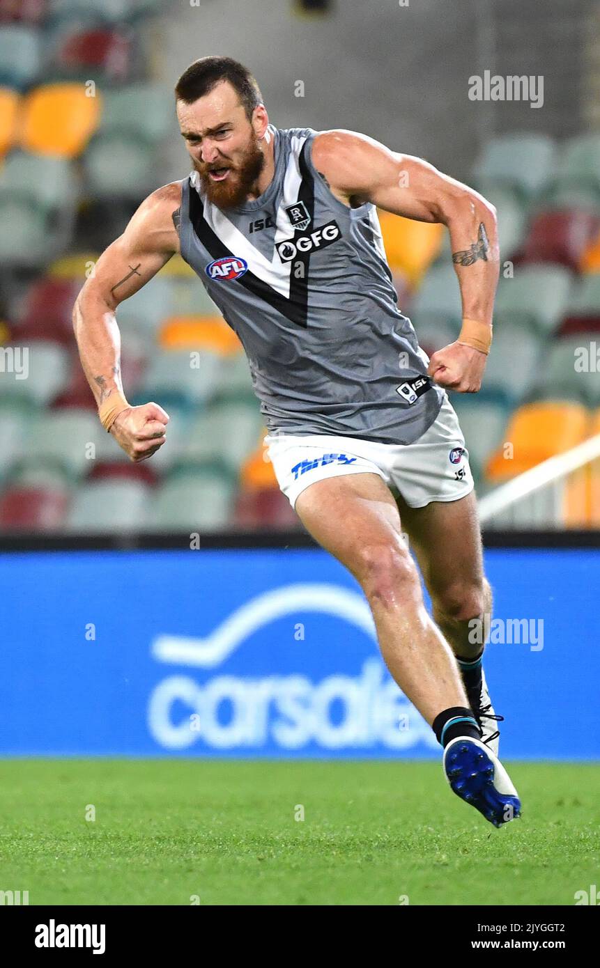 Charlie Dixon of the Power celebrates kicking a goal during the Round ...