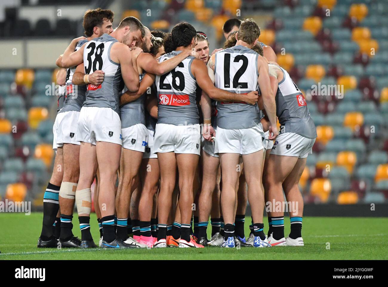 Power players are seen in a huddle during the Round 18 AFL match ...