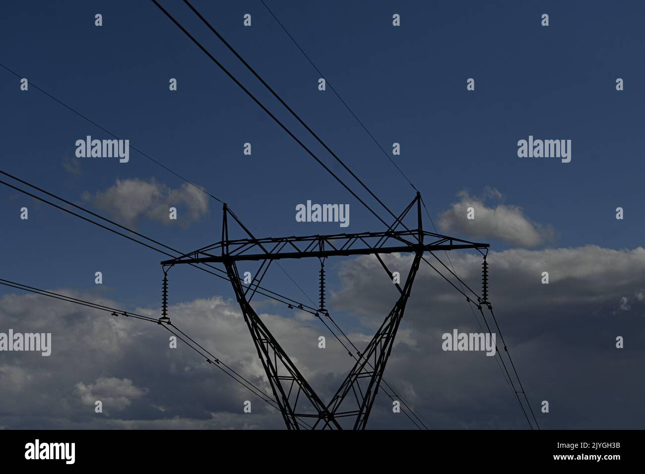 Power lines are seen leading towards a the suburb of Wright in Canberra ...