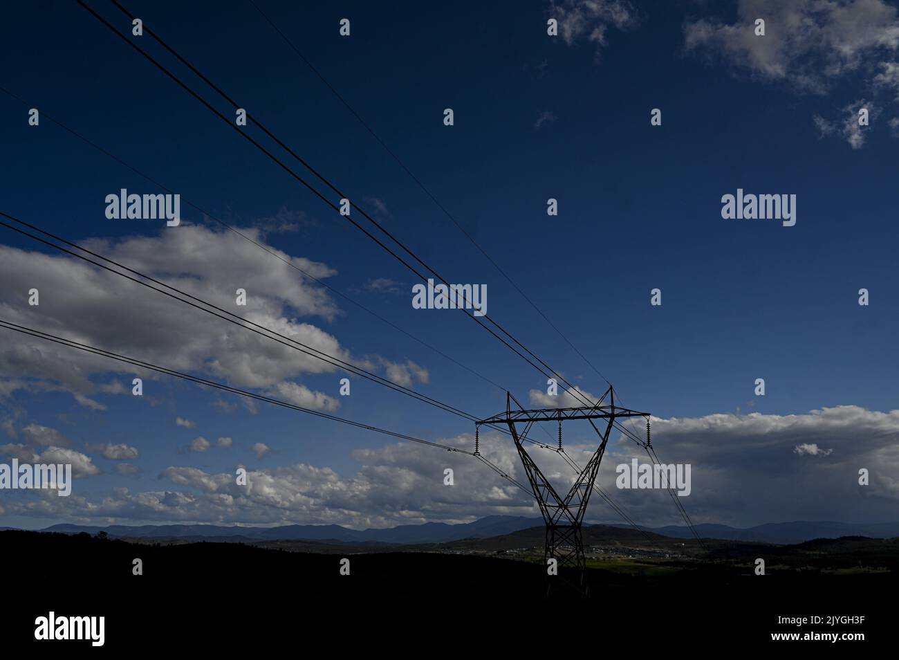 Power lines are seen leading towards a the suburb of Wright in Canberra ...