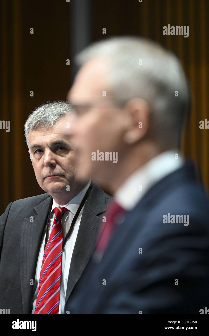 NBN Co CEO Stephen Rue listens to Australian Communications Minister ...