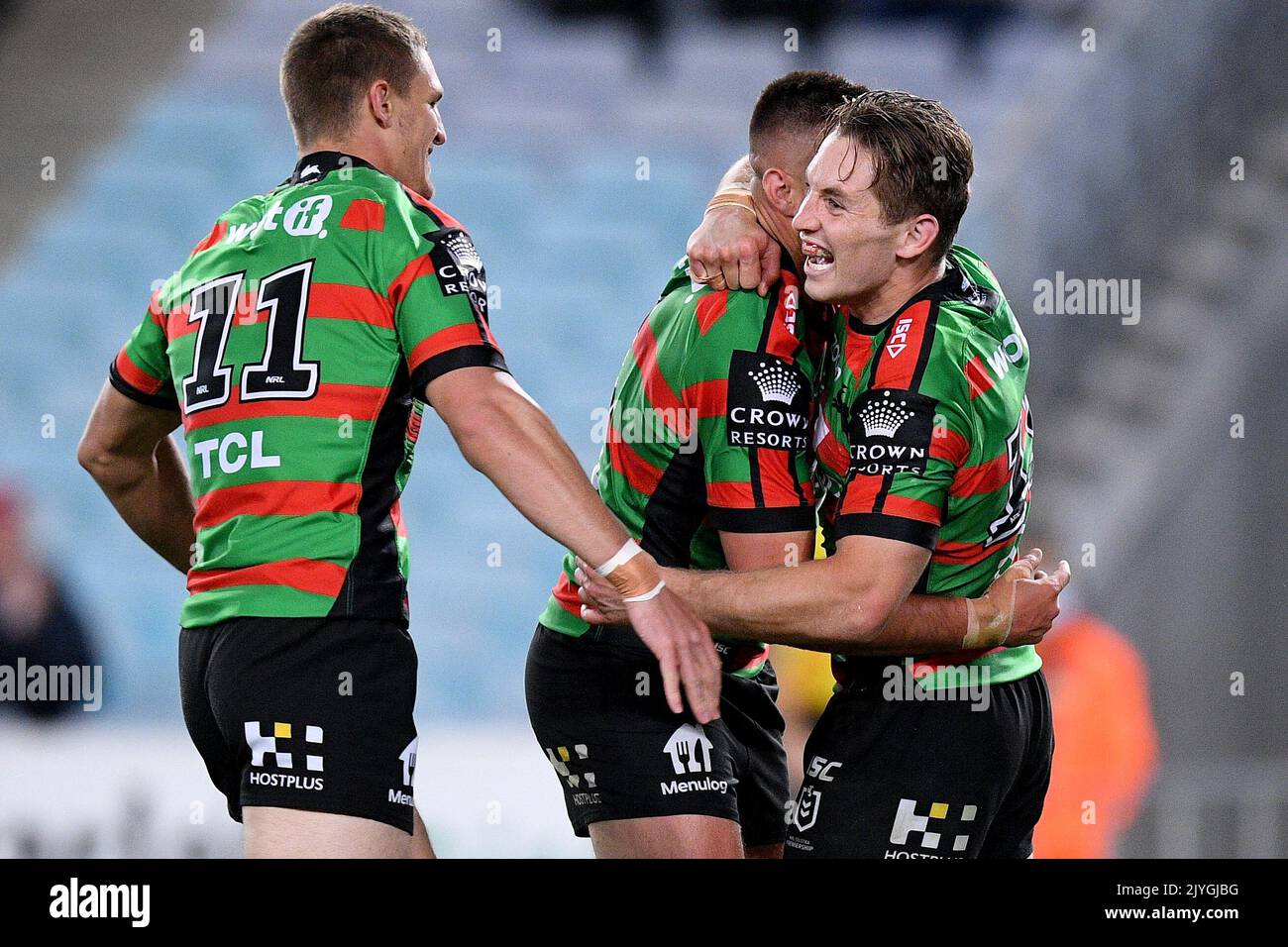 Corey Allan of the Rabbitohs (centre) celebrates with teammates after ...