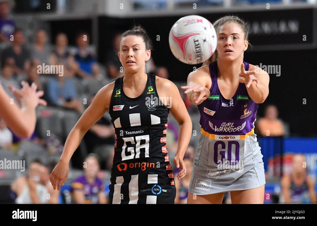 Kim Jenner (right) of the Firebirds passes to team mate during the ...