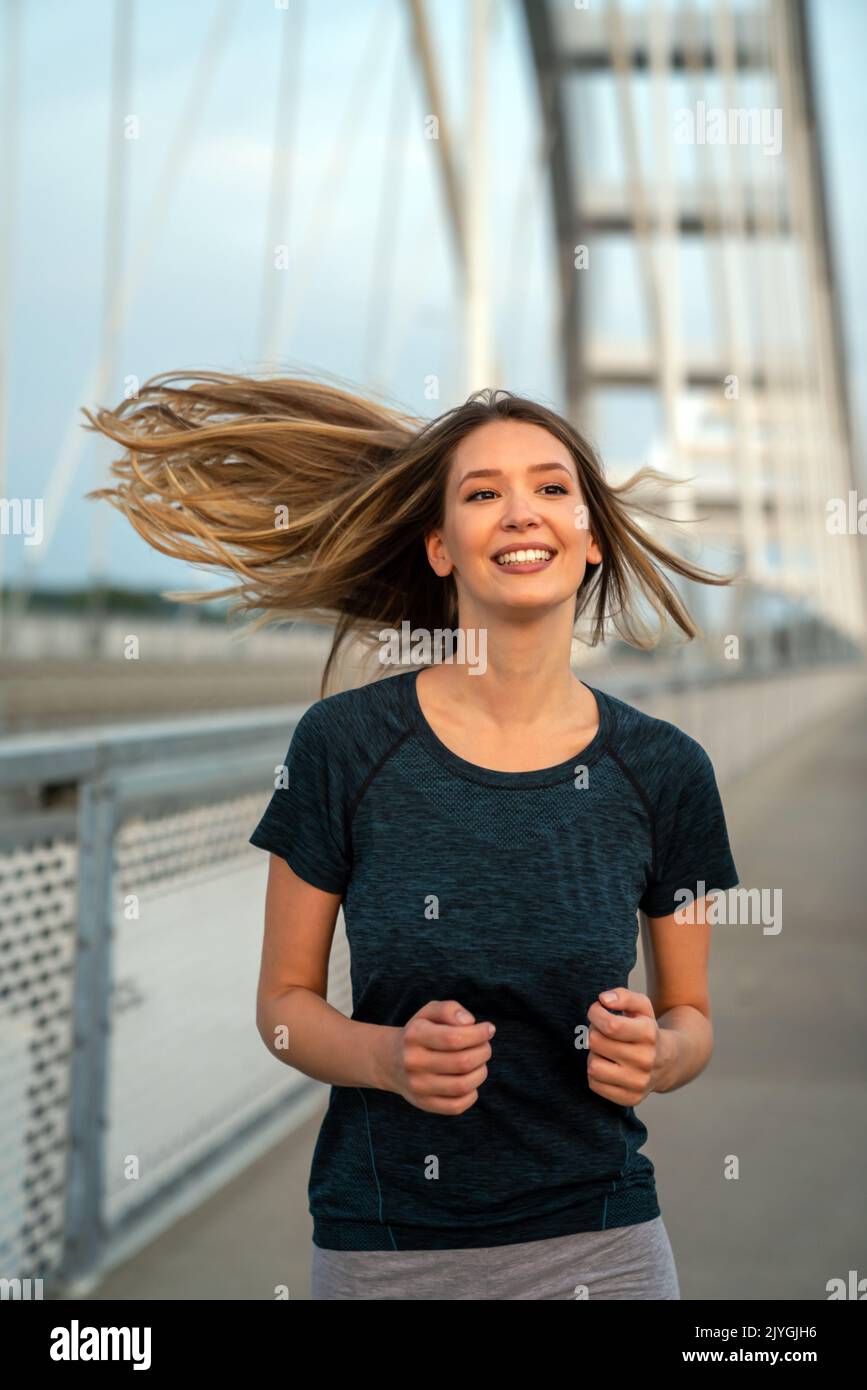 Fitness sport training and lifestyle concept. Happy fit woman running ...