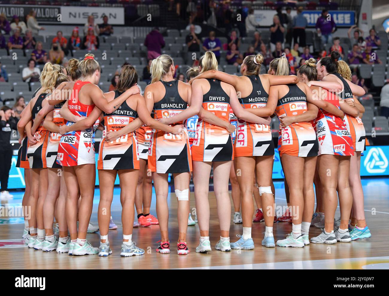 Swifts and Giants players are seen together after their draw during the ...