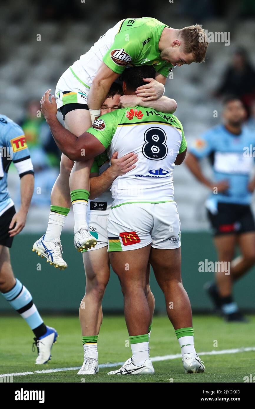 Dunamis Lui of the Raiders celebrates scoring a try with team mates ...