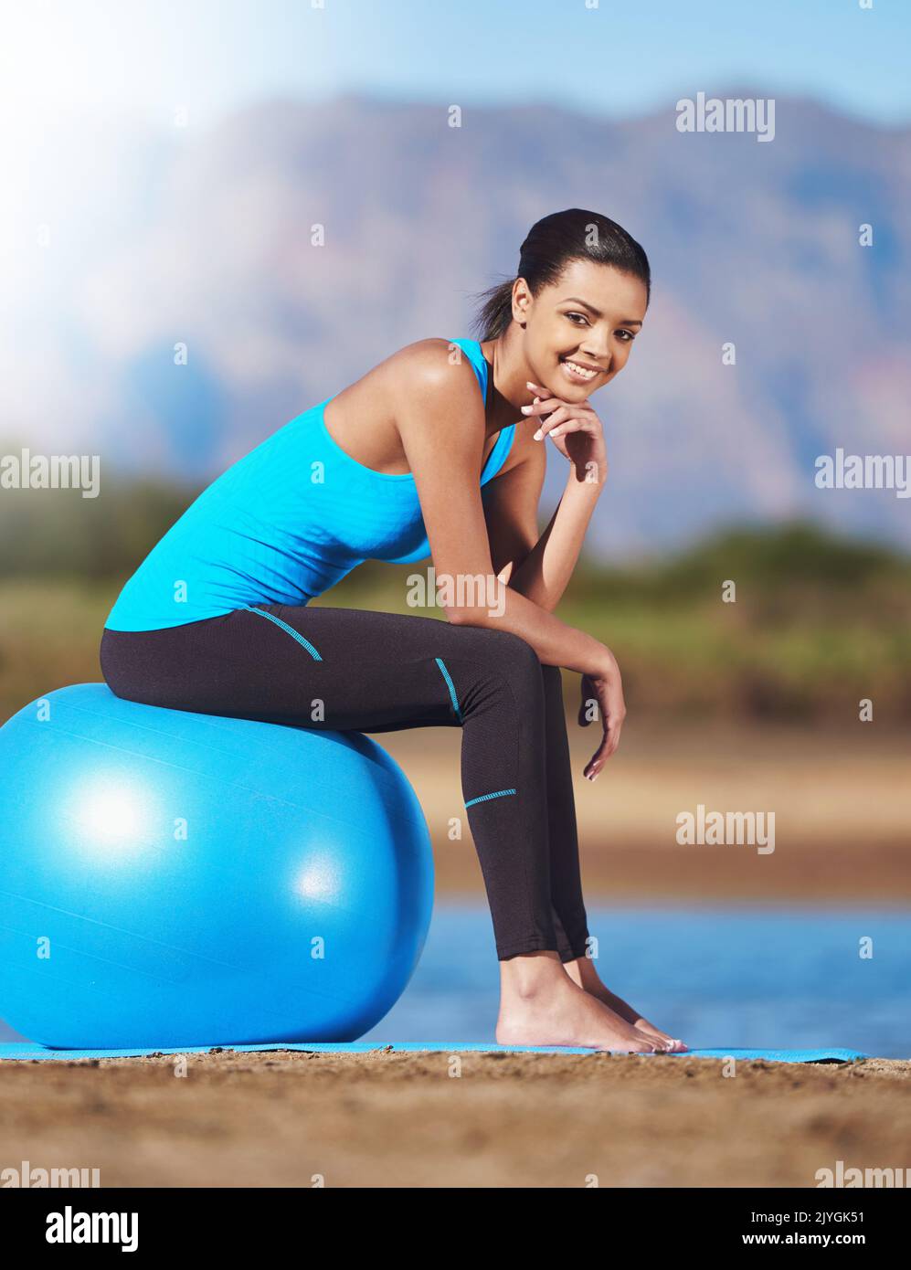 Make them wonder why youre smiling. a young woman taking a break on her ...