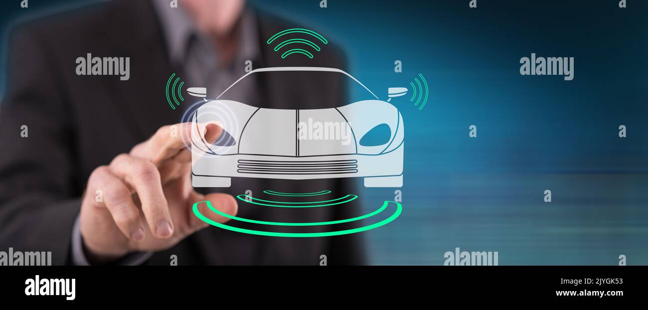 Man touching a smart car concept on a touch screen with his finger ...