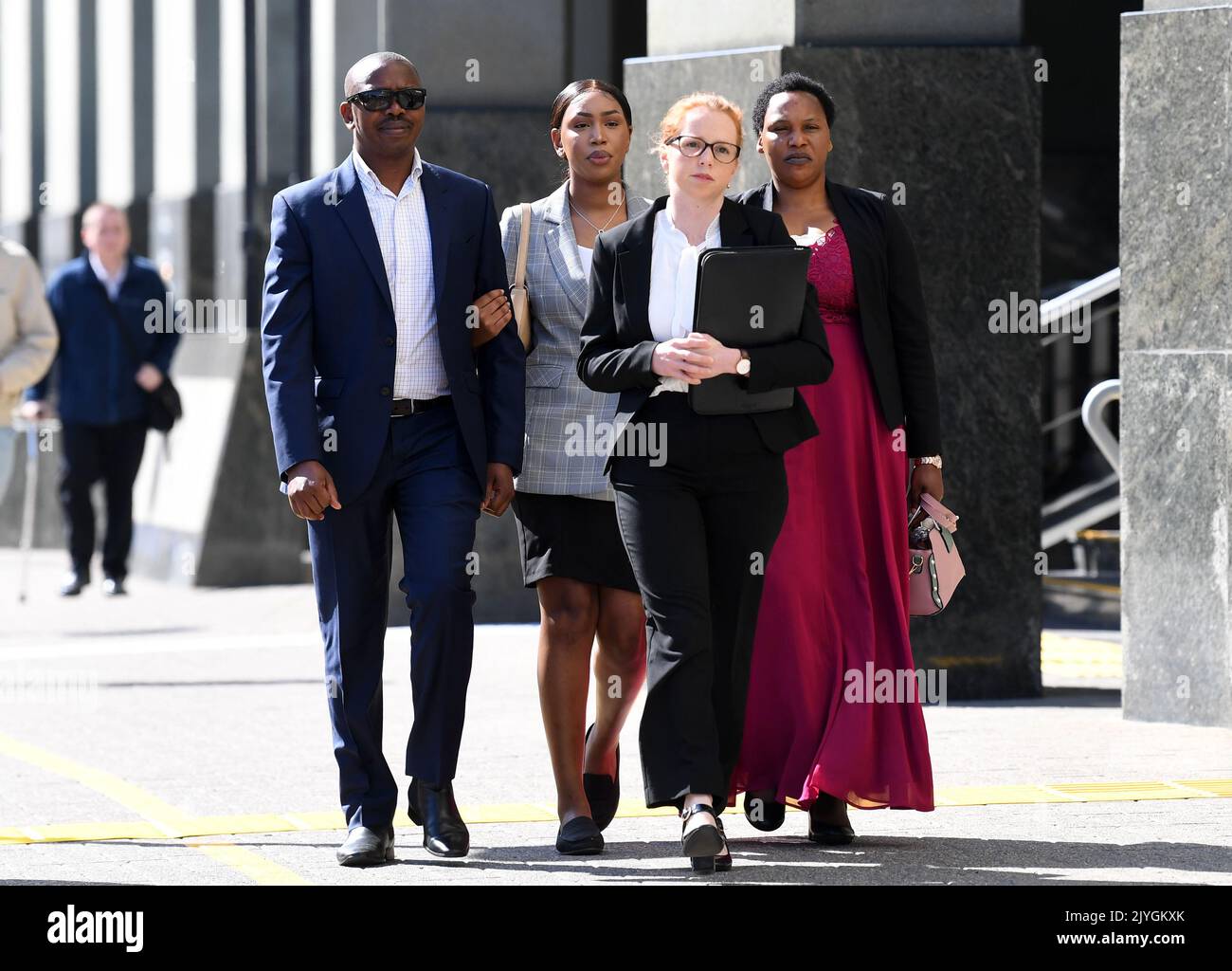 Olivia Winnie Muranga (centre) arrives to the Brisbane Magistrates ...