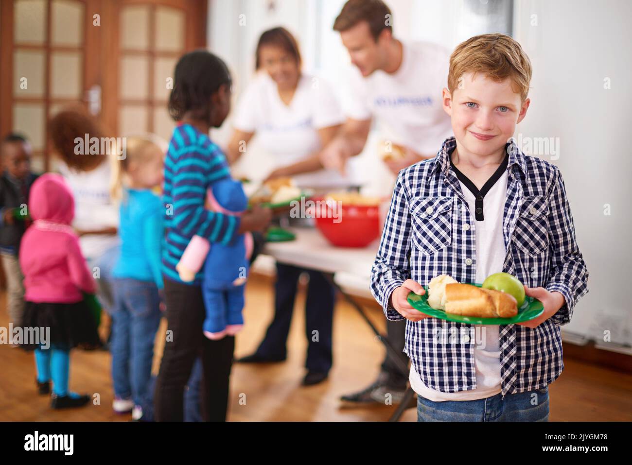 Making sure they never go hungry. Portrait of a little boy with a plate ...