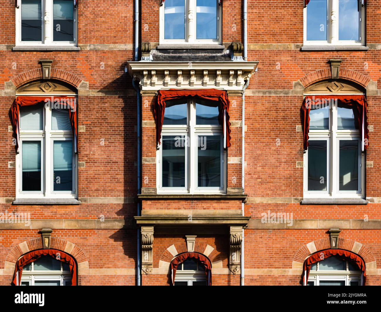 Sunlight on the windows of an old office building Stock Photo - Alamy