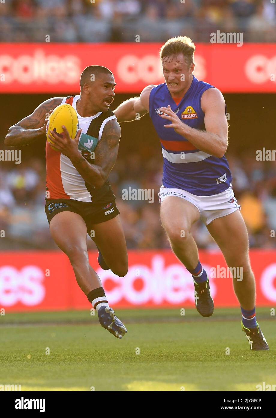 Bradley Hill of the Saints competes with Alex Keath of the Bulldogs ...