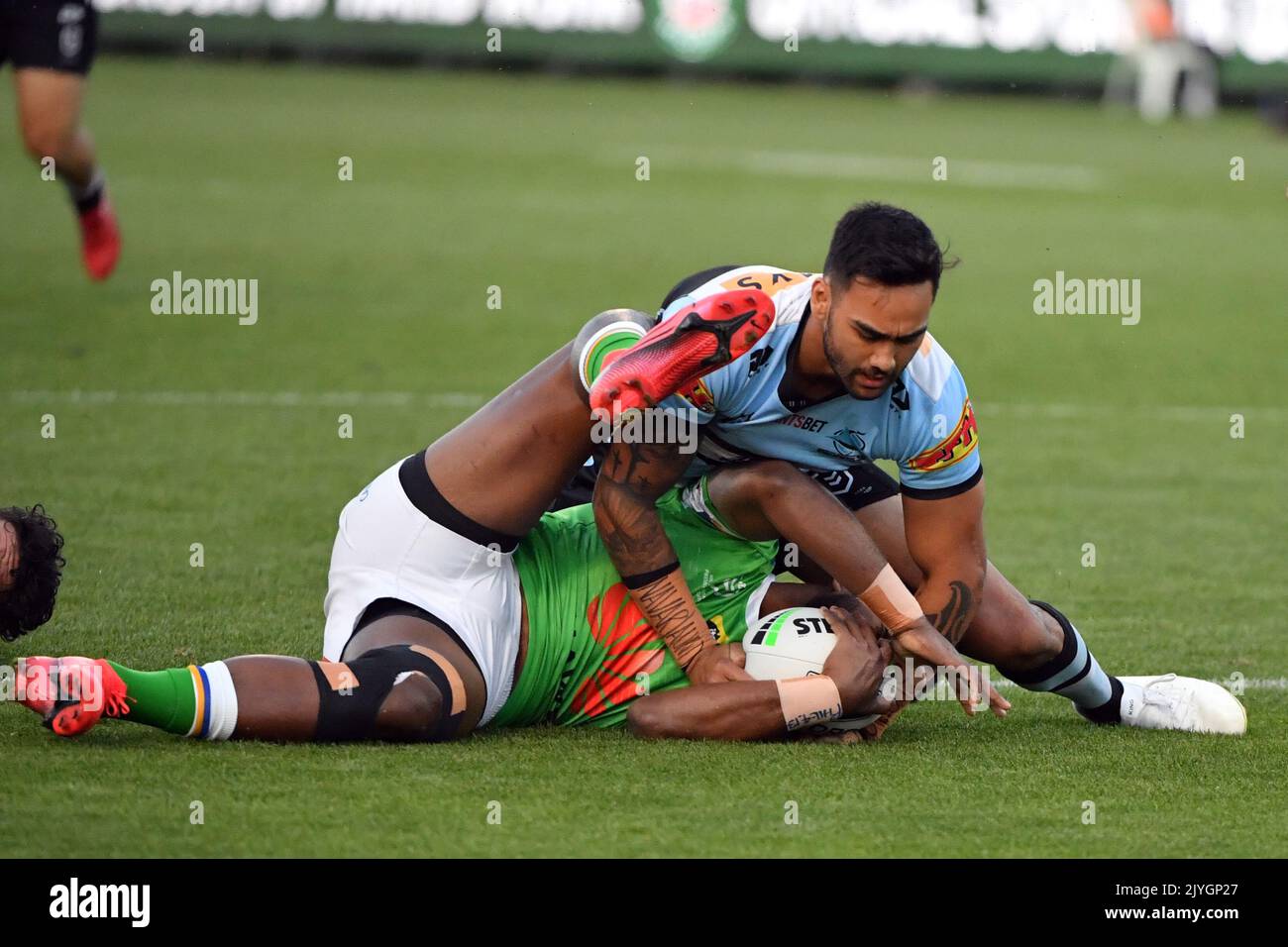 Raiders Semi Valemei is tackled by Sharks Briton Nikora in the ingoal ...