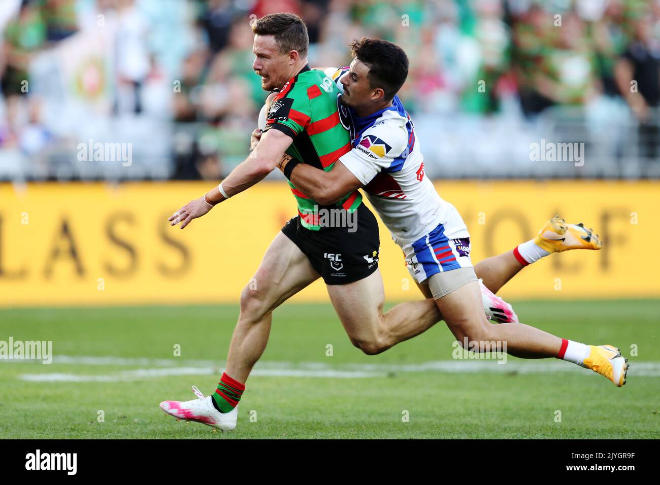 Damien Cook of the Rabbitohs is tackled by Enari Tuala of the Knights ...