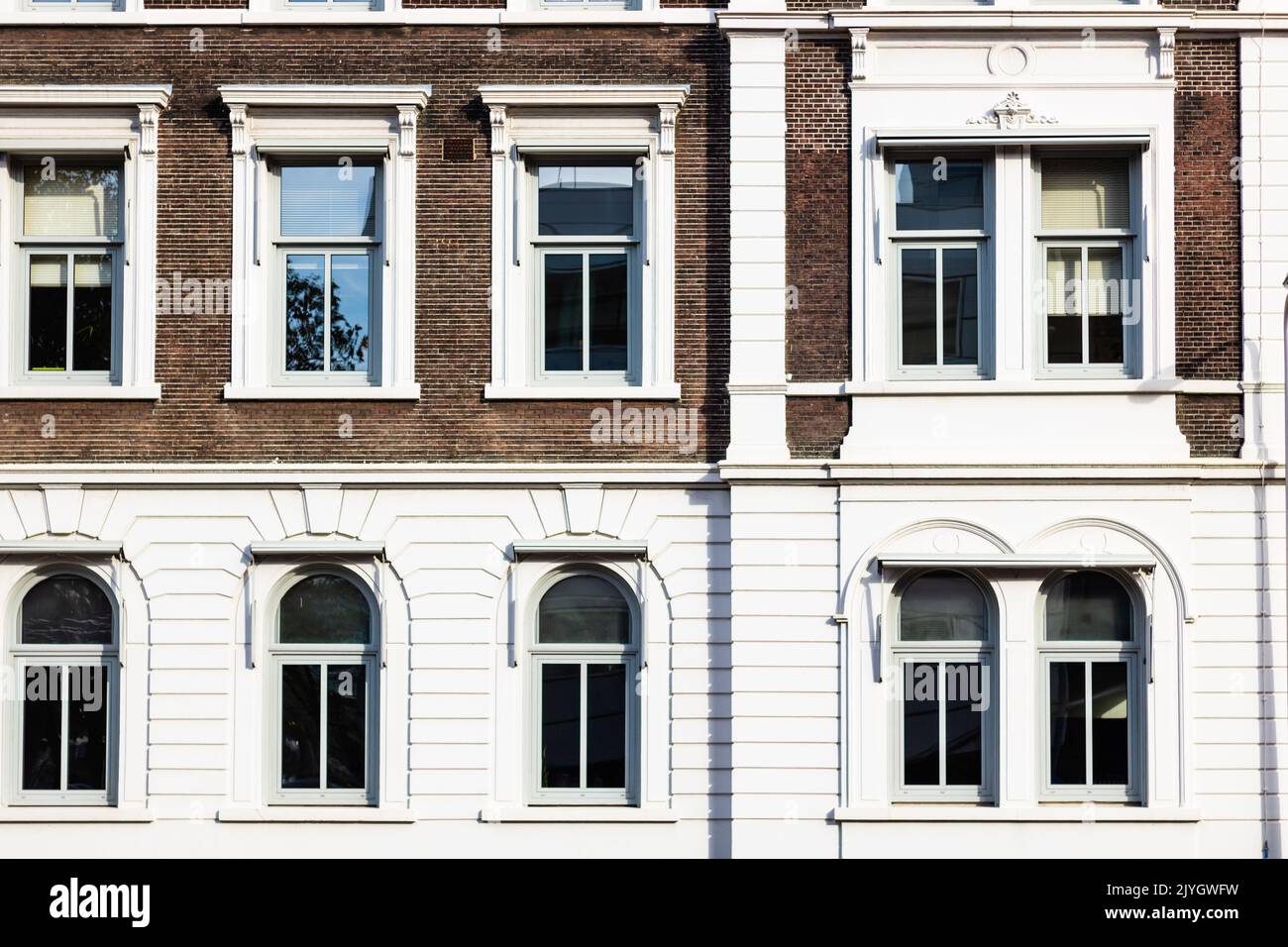 Sunlight on the windows of an old office building Stock Photo - Alamy