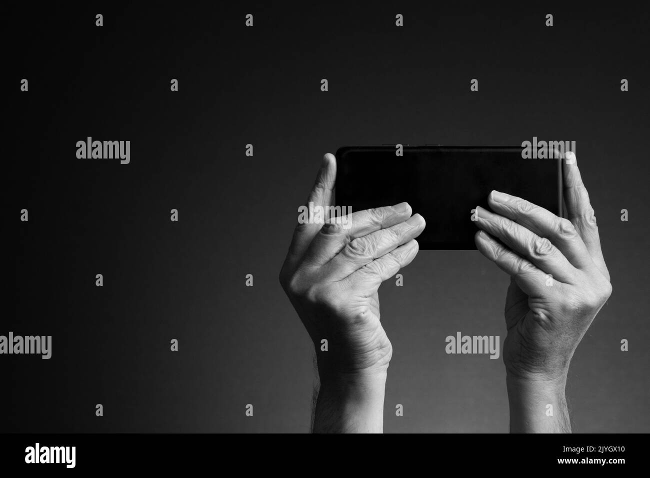 Mans hands hold phone Black and White Stock Photos & Images - Alamy