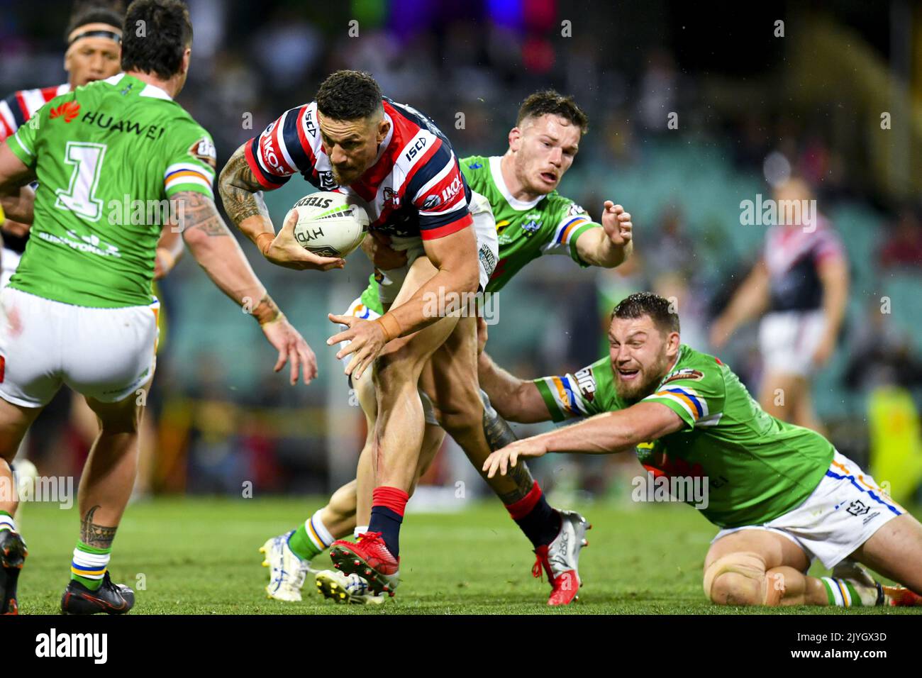 Sonny Bill Williams of the Roosters is tackled during the first NRL ...