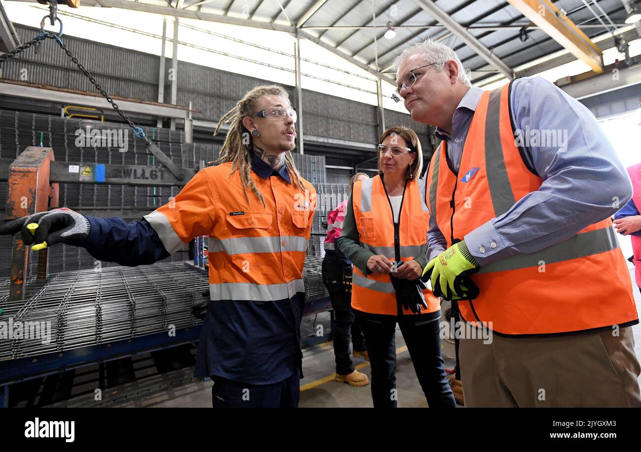 Steel worker John Simpson (left) speaks is seen with Queensland LNP ...