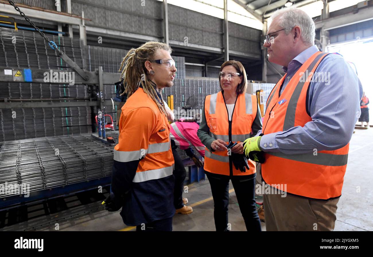 Steel worker John Simpson (left) speaks is seen with Queensland LNP ...