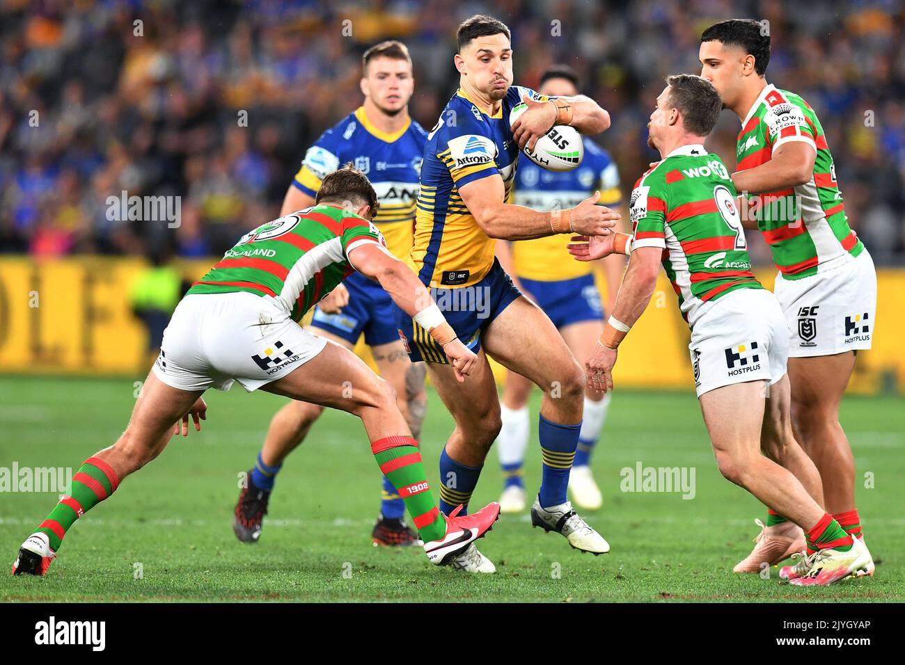 Ryan Matterson of the Eels looks to push through Liam Knight and Damien ...
