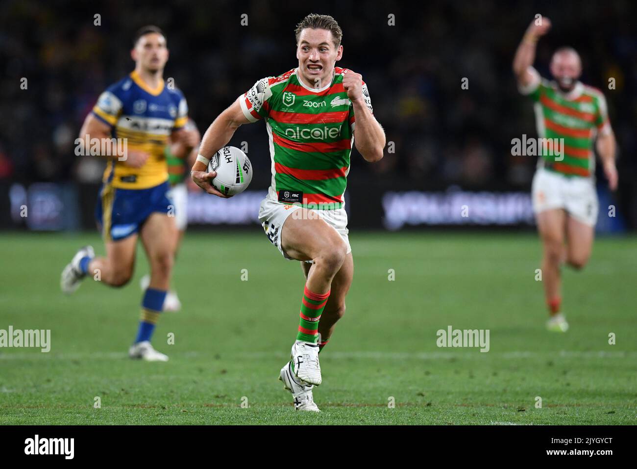 Cameron Murray of the Rabbitohs finds a break to run away and score ...