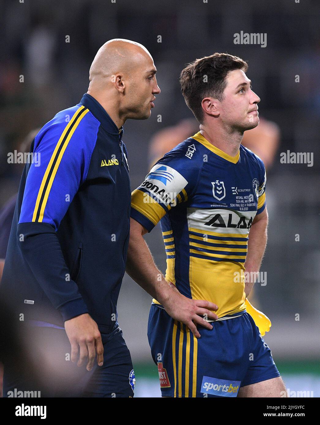 Blake Ferguson (left) consoles Mitchell Moses of the Eels following the ...