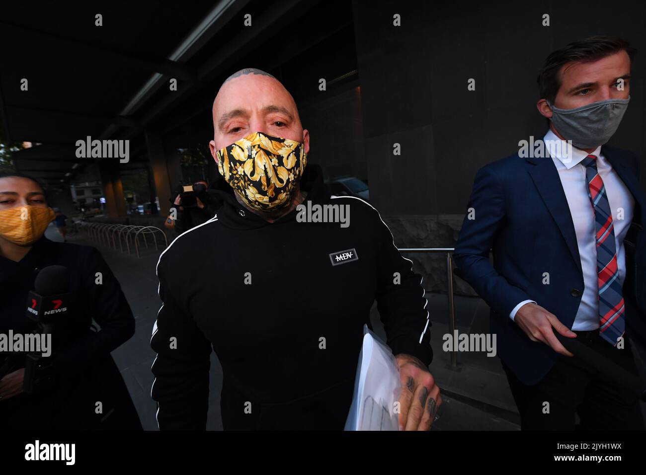 Mongols bikie boss Toby Mitchell (centre) is seen departing City West ...