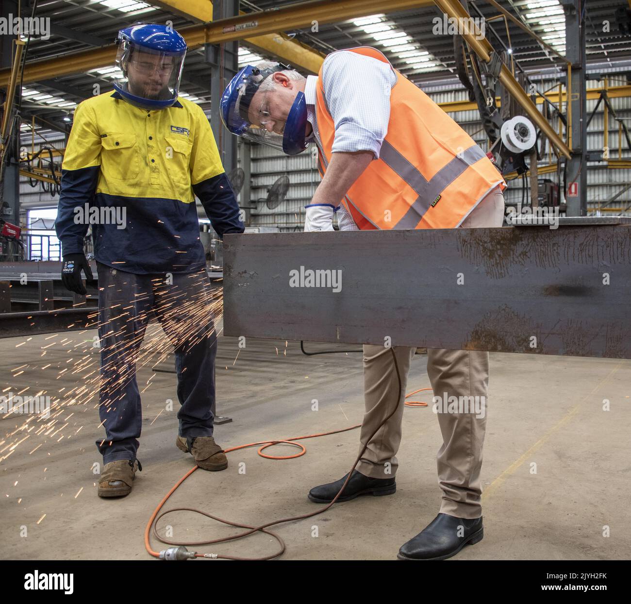 Prime Minister Scott Morrison welds with the help of employee Ashley Gosley at the CSF ...