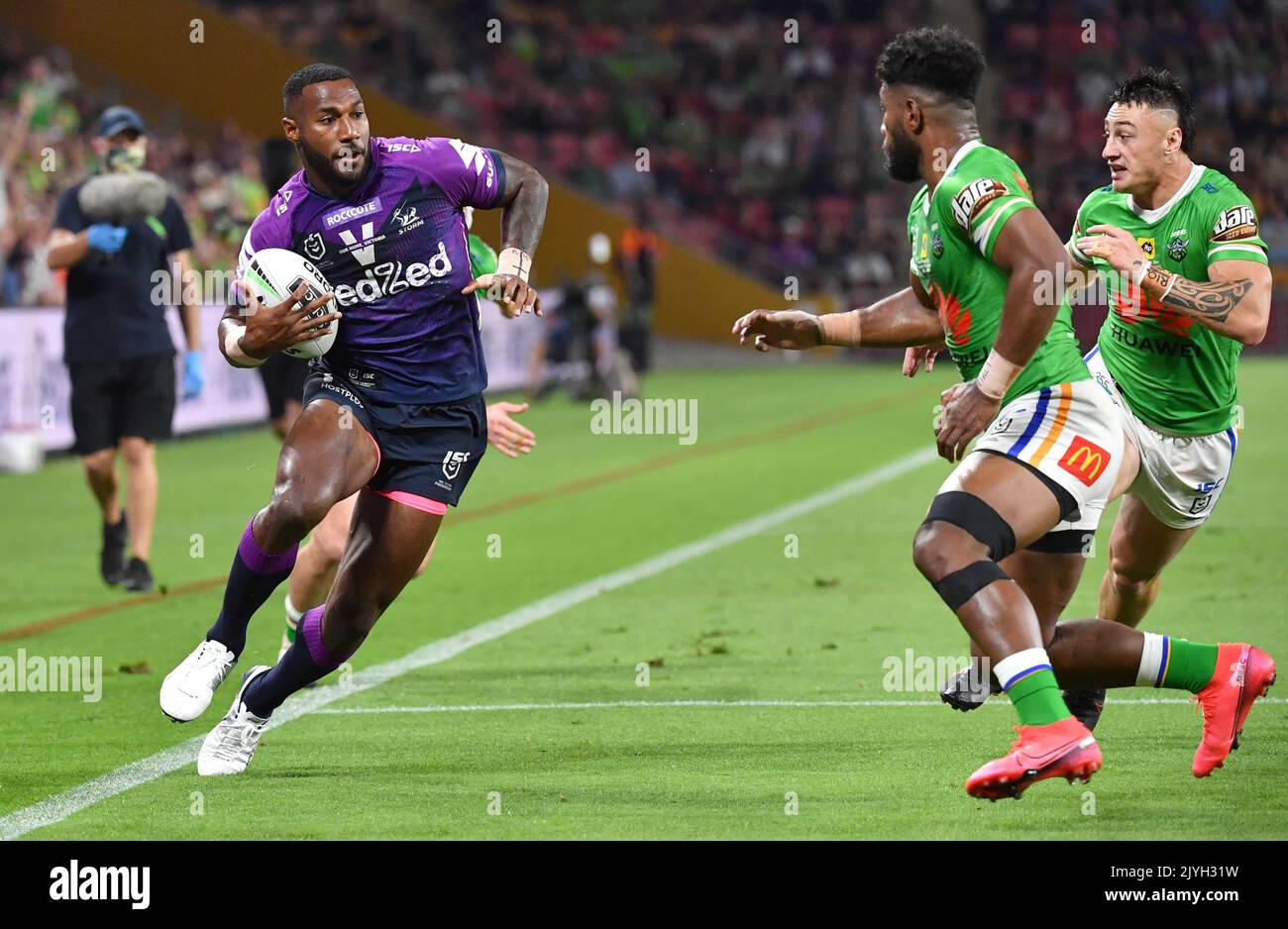 Suliasi Vunivalu (left) of the Storm runs down the sideline to score a ...