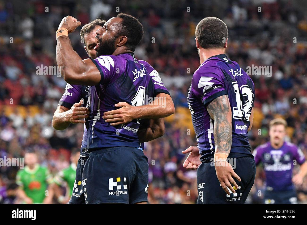 Justin Olam of the Storm (centre) celebrates with Cameron Smith (left ...