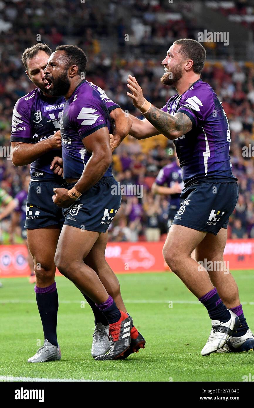 Justin Olam of the Storm (centre) celebrates with Cameron Smith (left ...