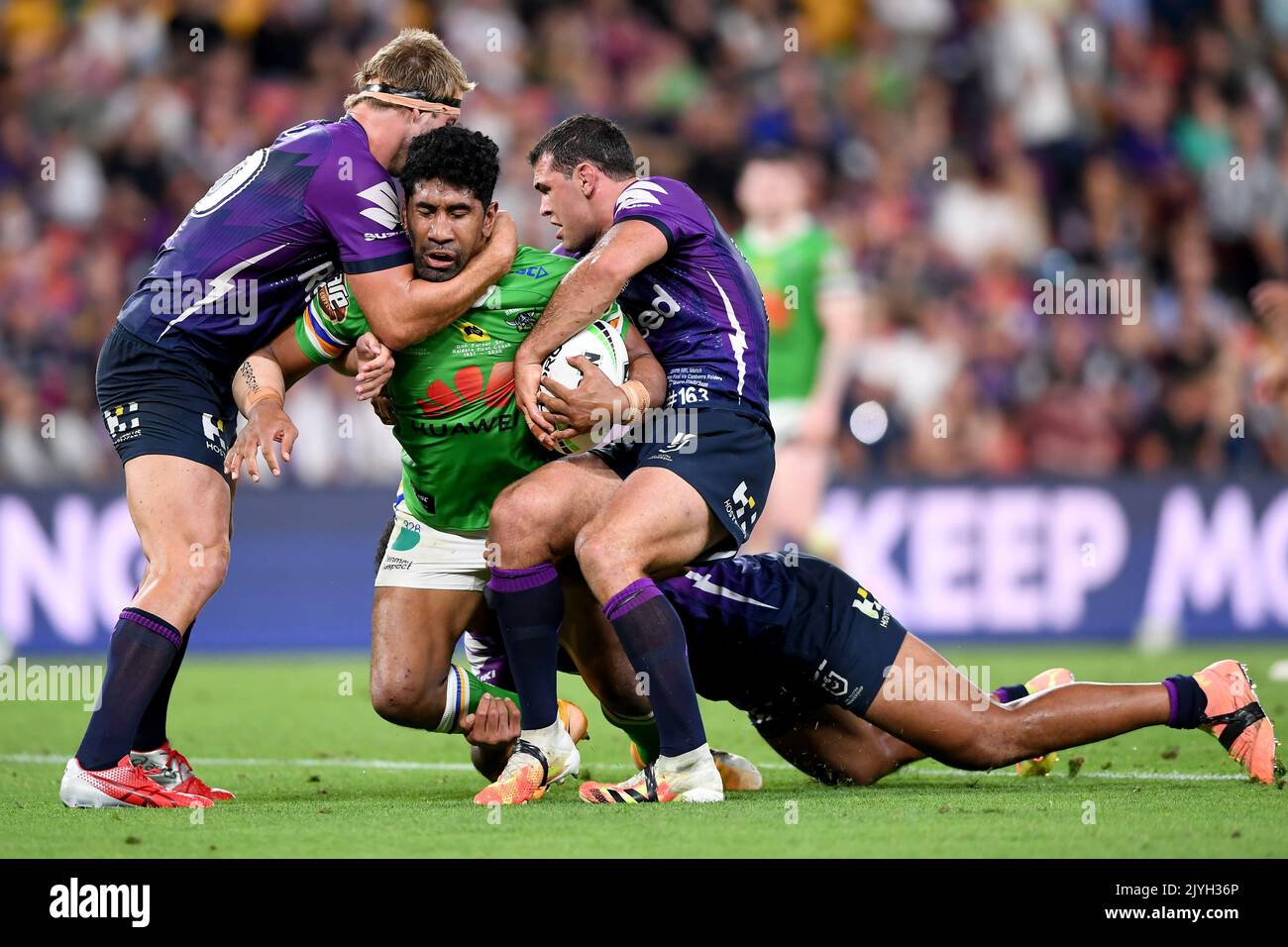 Iosia Soliola of the Raiders is tackled by Christian Welch (left) and ...