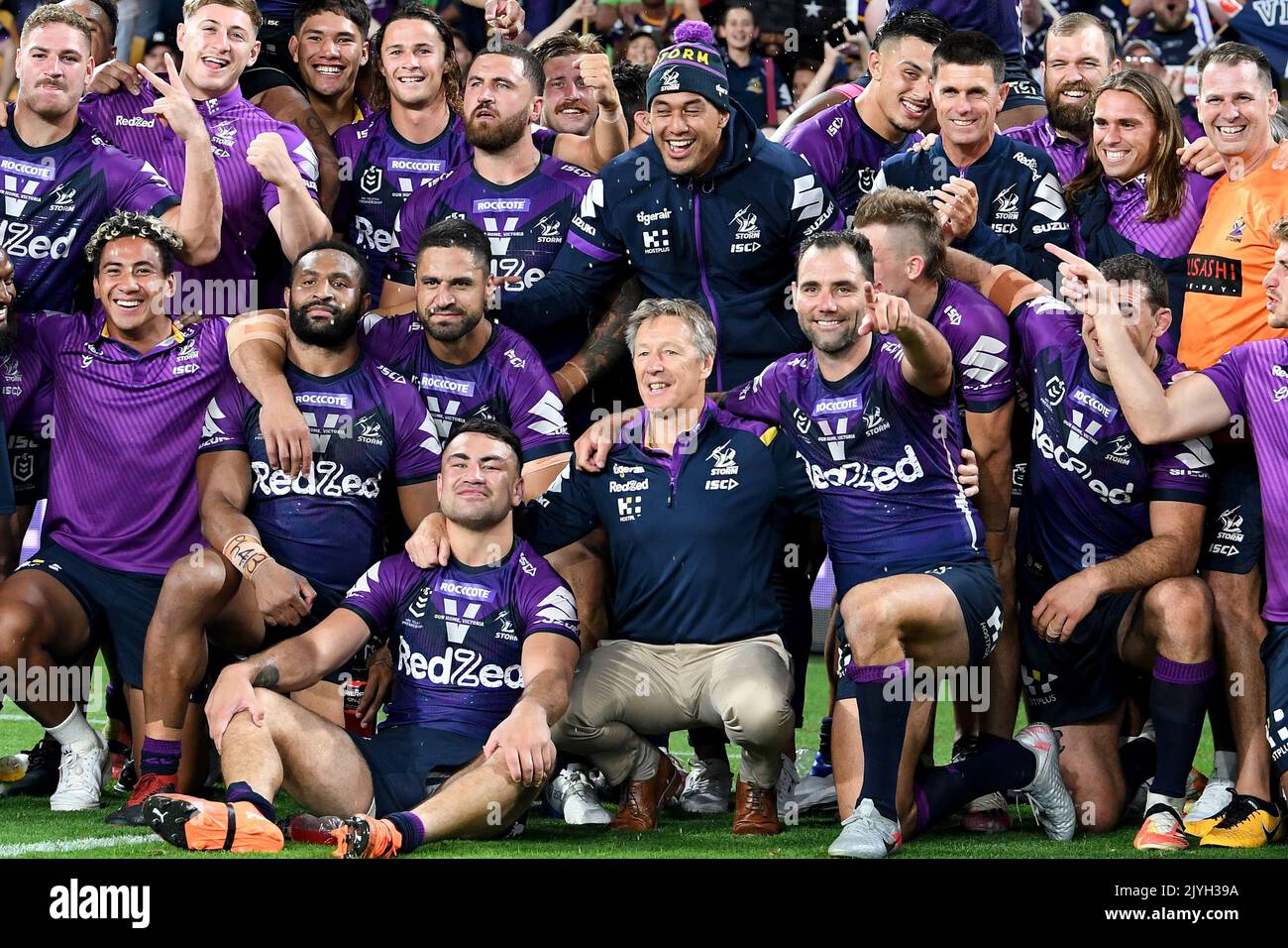 Melbourne Storm players with coach Craig Bellamy and staff assemble for a photograph in front of ...