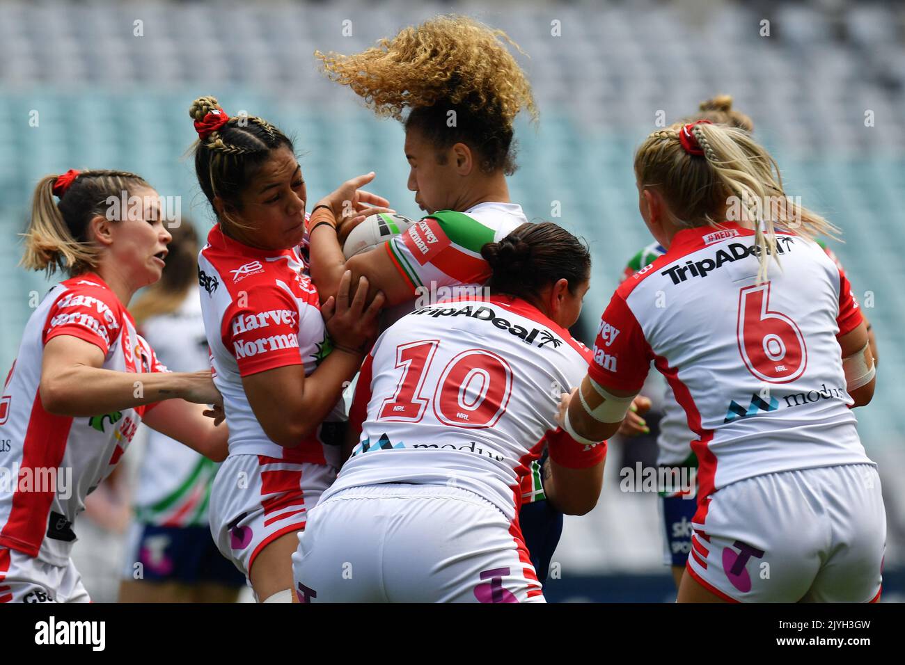 Teaghan Hartigan of the Warriors is tackled by the Dragons defence ...