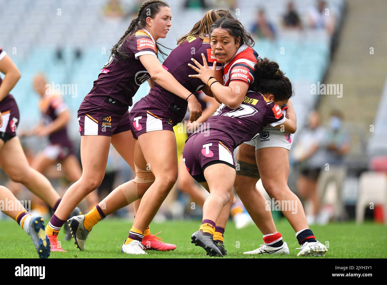 Filomina Hanisi of the Roosters is tackled by Millie Boyd of the ...