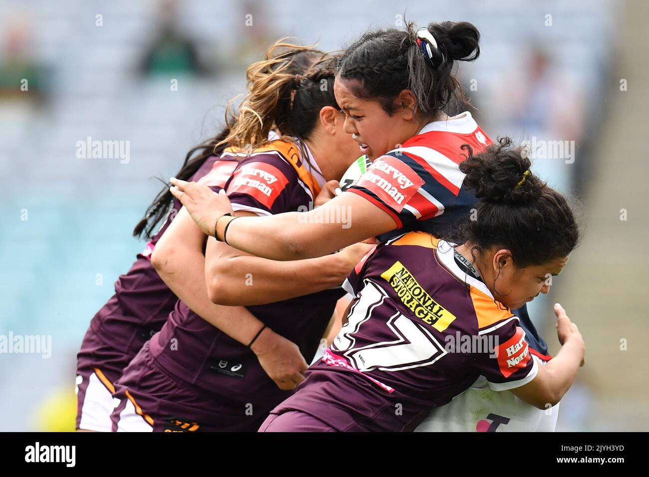 Filomina Hanisi of the Roosters is tackled by Millie Boyd of the ...