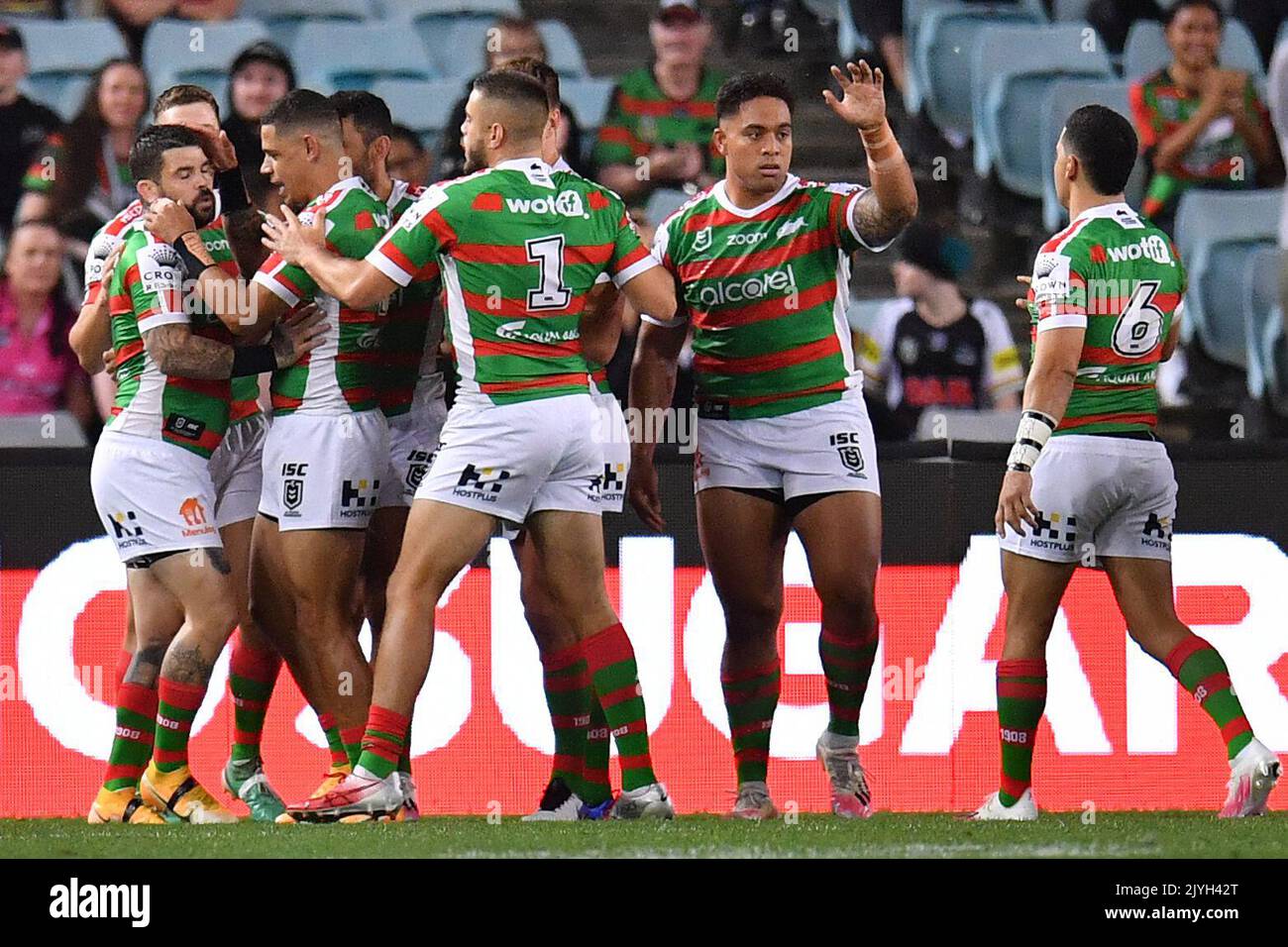 The Rabbitohs celebrate Alex Johnston's opening try during the NRL ...