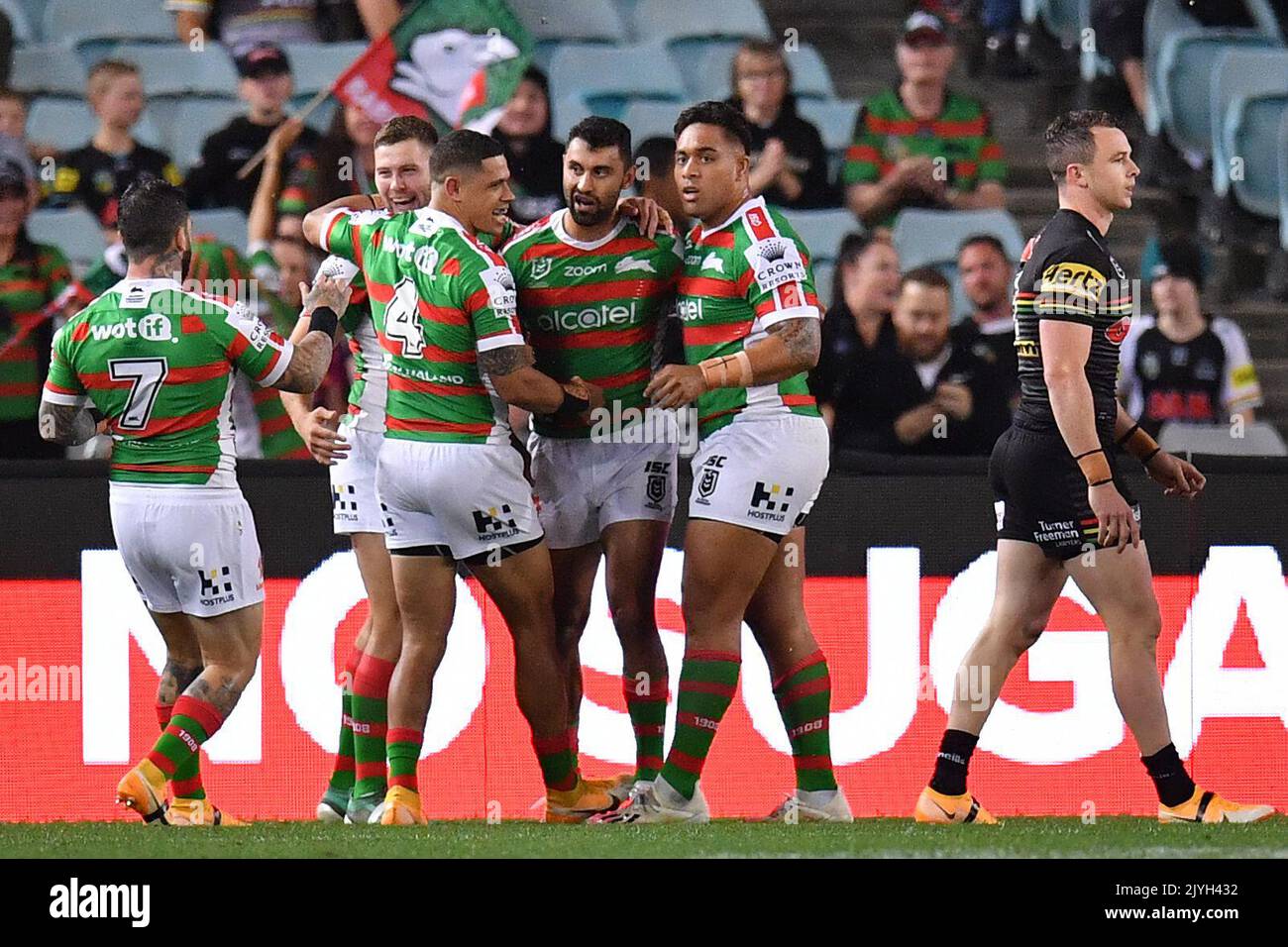 The Rabbitohs celebrate Alex Johnston's opening try during the NRL ...