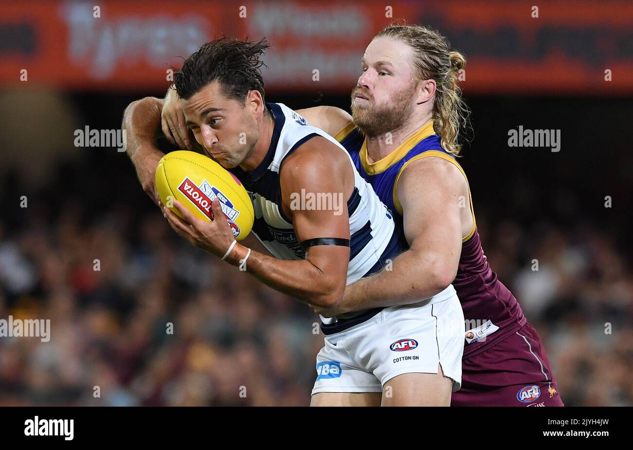 Luke Dahlhaus of the Cats (left) and Daniel Rich of the Lions compete ...