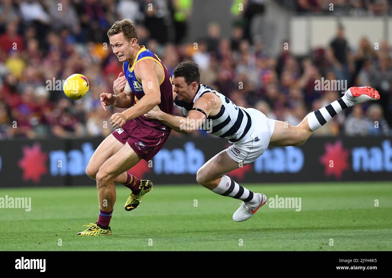 Patrick Dangerfield of the Cats competes with Ryan Lester of the ...