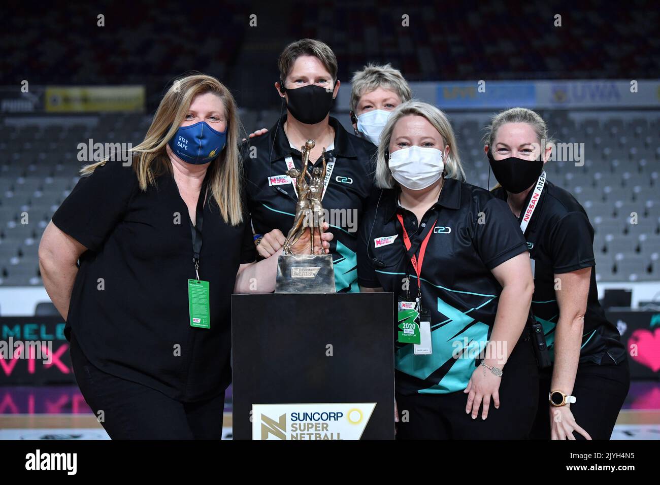 Netball officers are seen with Suncorp Super Netball trophy before the ...