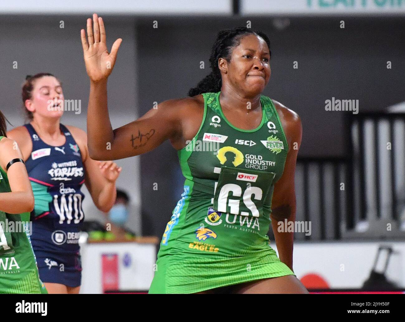 Jhaniele Fowler (centre) of the Fever celebrates shooting a goal with ...