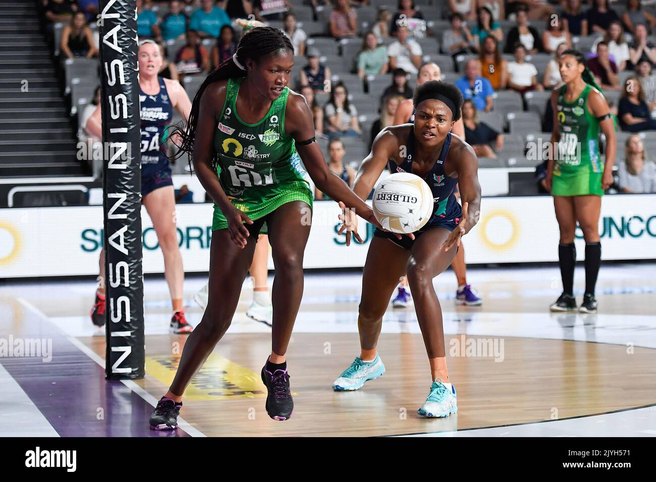 Sunday Aryang of the Fever and Mwai Kumwenda of the Vixens compete for ...