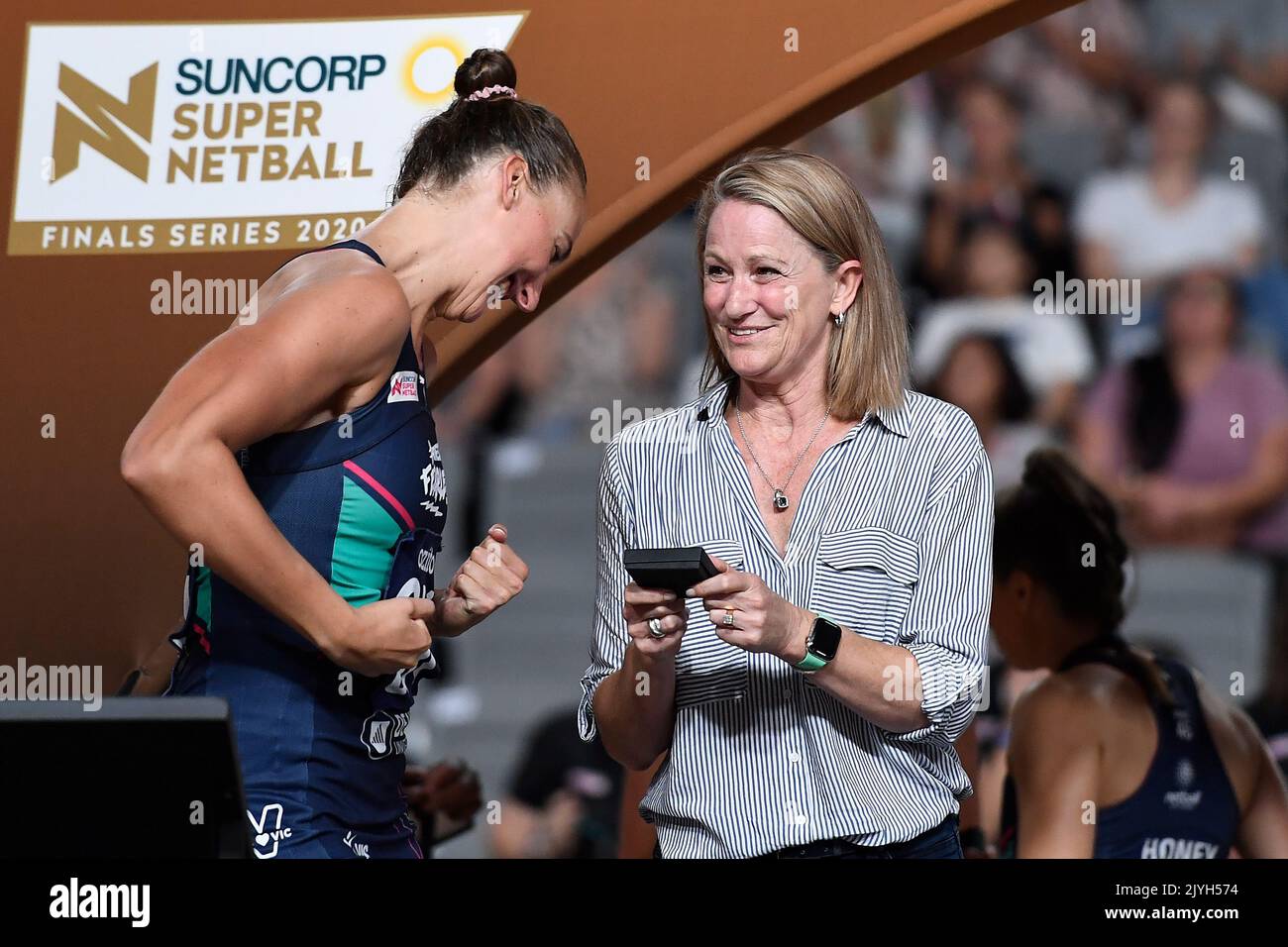 Melbourne Vixens head coach Simone McKinnis presents Emily Mannix with ...