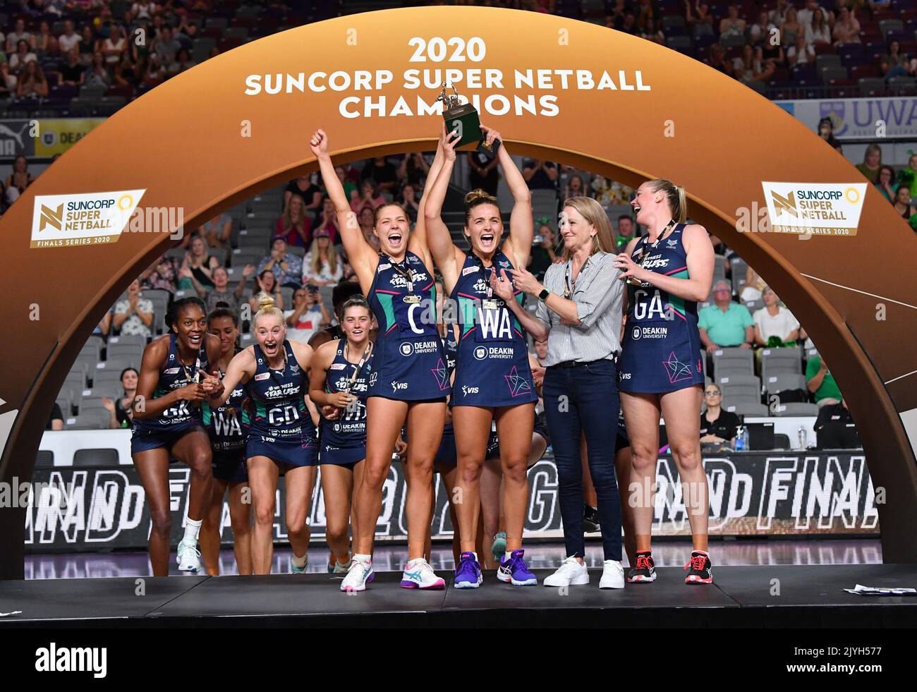 Vixens players celebrate with the trophy after winning the Super ...