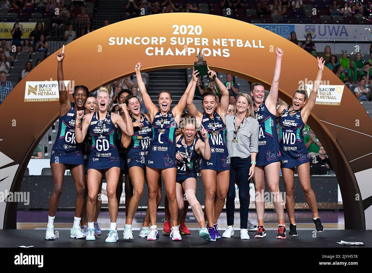 Melbourne Vixens players celebrate with the trophy after their victory ...