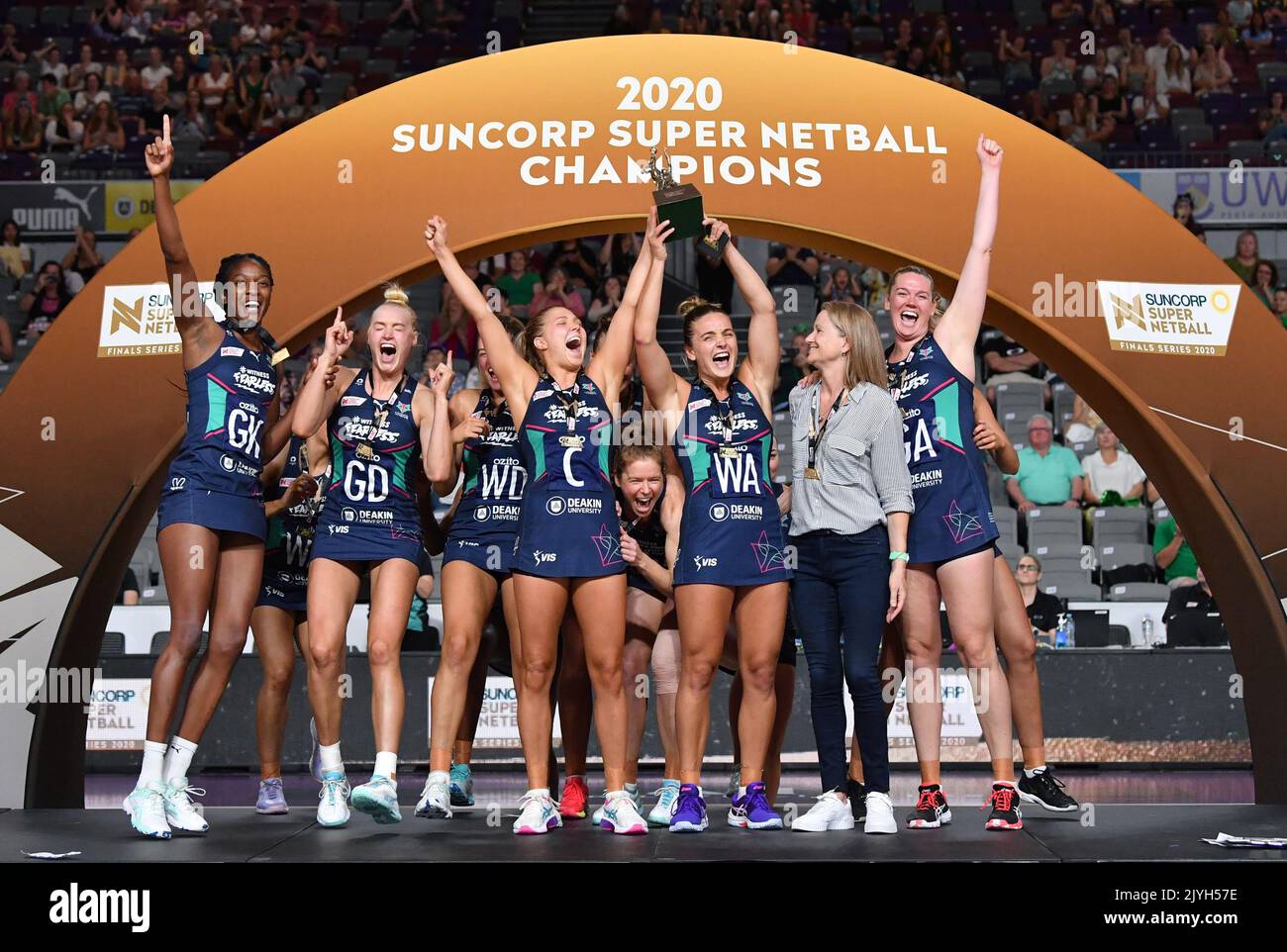 Vixens players celebrate with the trophy after winning the Super ...