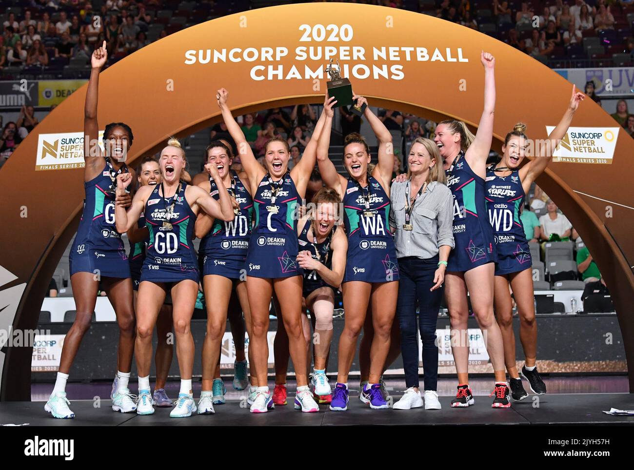 Vixens players celebrate with the trophy after winning the Super ...