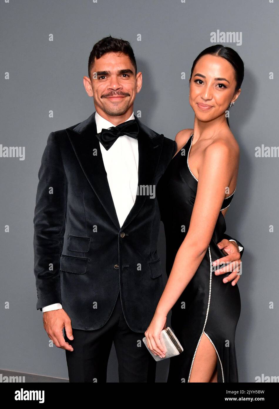 Charlie Cameron of the Lions and his partner Caitlin Seeto are seen ...