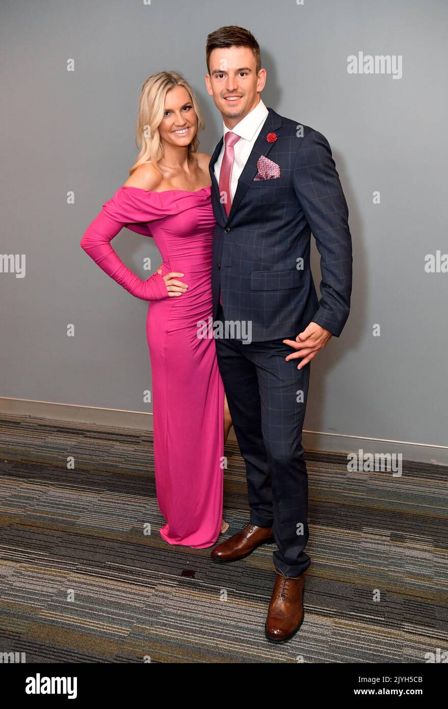 Jarryd Lyons of the Lions and his partner Savahna Lyons are seen ...